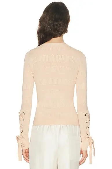 AKNVAS Ribbed Striped Knit Top With Lace-up Cuffs
