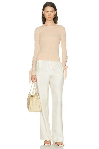 AKNVAS Ribbed Striped Knit Top With Lace-up Cuffs