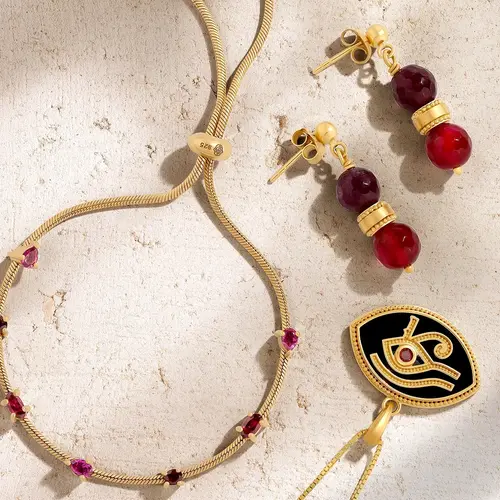 KARMA AND LUCK Garnet Gold-plated Bolo Bracelet