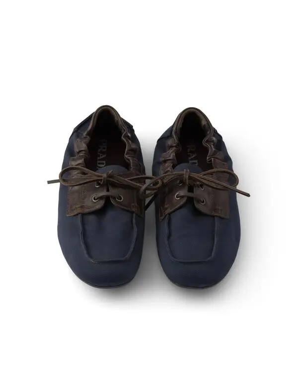 Prada Aged Canvas And Leather Boat Shoes - Blue