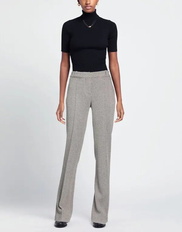 THE MANNEI Flared Herringbone Trousers
