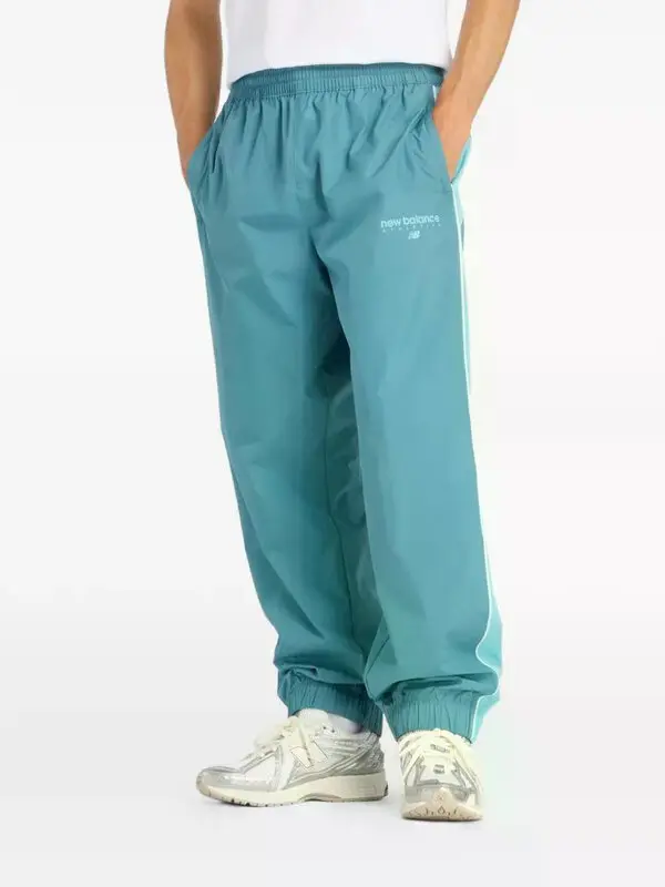 NEW BALANCE Trackside Woven Track Pants