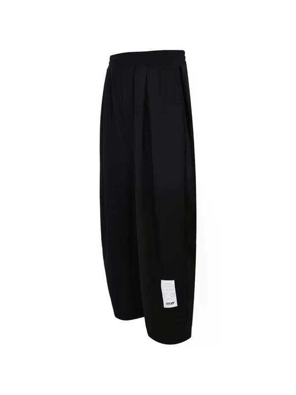 TEE LIBRARY Pleated Logo-patch Trousers