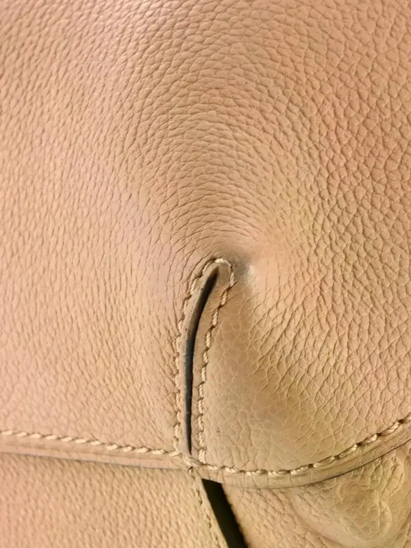 LOUIS VUITTON Bagatelle Monogram Empreinte Leather Hobo Bag - Neutrals