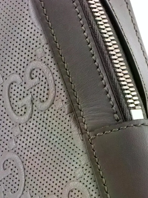 Gucci Sling Gg Embossed Perforated Leather Backpack