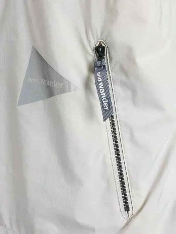 AND WANDER Pertex Quantum Air Logo-print Zip-pocket T-shirt