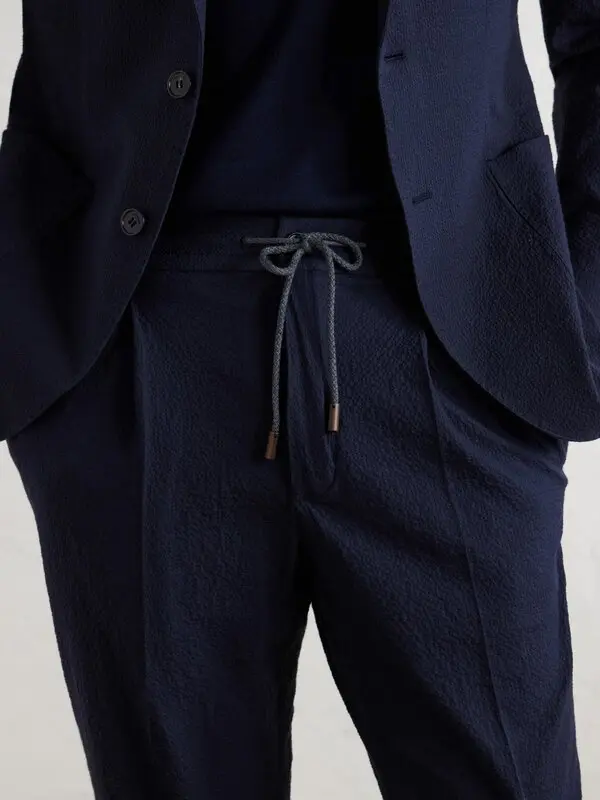 SLOWEAR Tapered Cotton-blend Seersucker Trousers