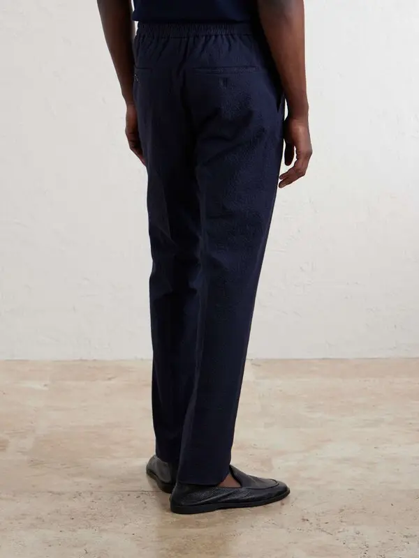 SLOWEAR Tapered Cotton-blend Seersucker Trousers