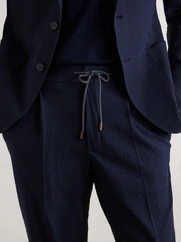 SLOWEAR Tapered Cotton-blend Seersucker Trousers