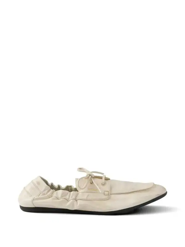 Prada Antiqued Leather Boat Shoes With Lettering Logo - Neutrals