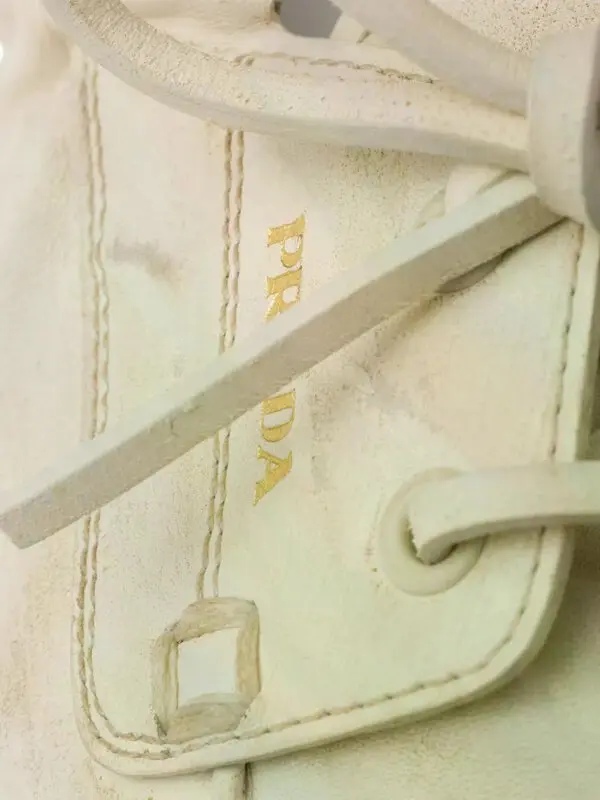 Prada Antiqued Leather Boat Shoes With Lettering Logo - Neutrals