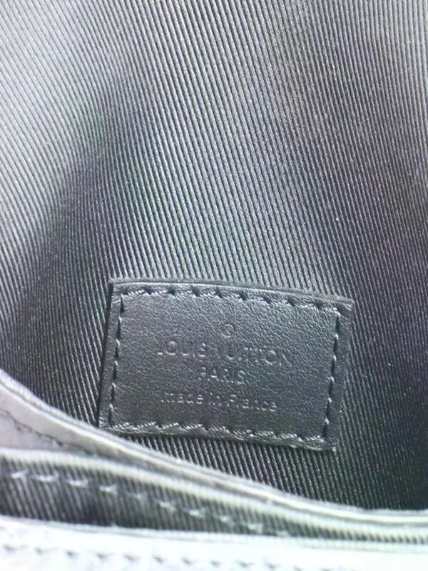 LOUIS VUITTON S Lock Vertical Wearable Wallet Monogram Taurillon Leather - Black