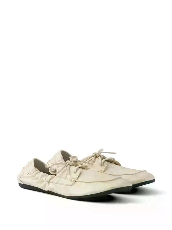 Prada Antiqued Leather Boat Shoes With Lettering Logo - Neutrals