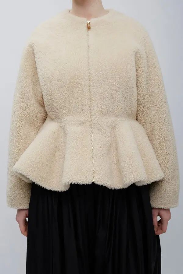 Alaïa Peplum Shearling Jacket
