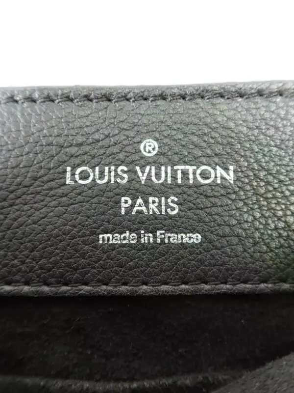 LOUIS VUITTON Lock Me Leather Backpack
