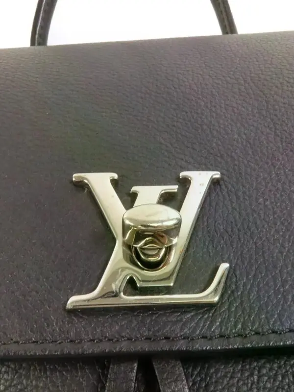LOUIS VUITTON Lock Me Evergrain Leather Backpack