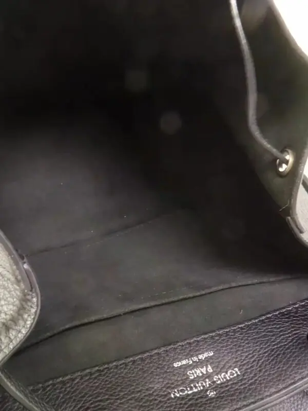 LOUIS VUITTON Lock Me Evergrain Leather Backpack