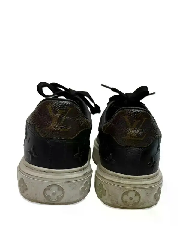 LOUIS VUITTON Leather Monogram Embossed Time Out Sneakers