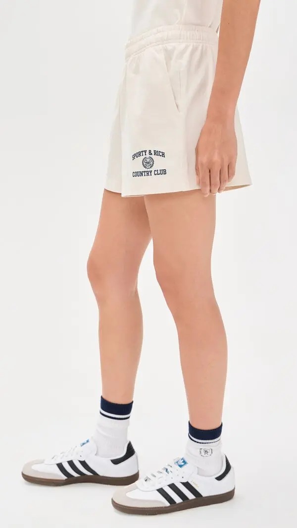SPORTY & RICH Varsity Crest Disco Shorts - Ecru