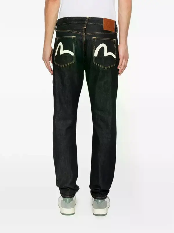 EVISU Logo Print Jeans