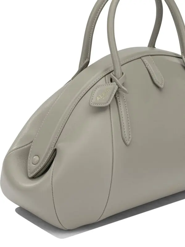 Alaïa Medium Purse Top Handle Handbag In Smooth Calfskin