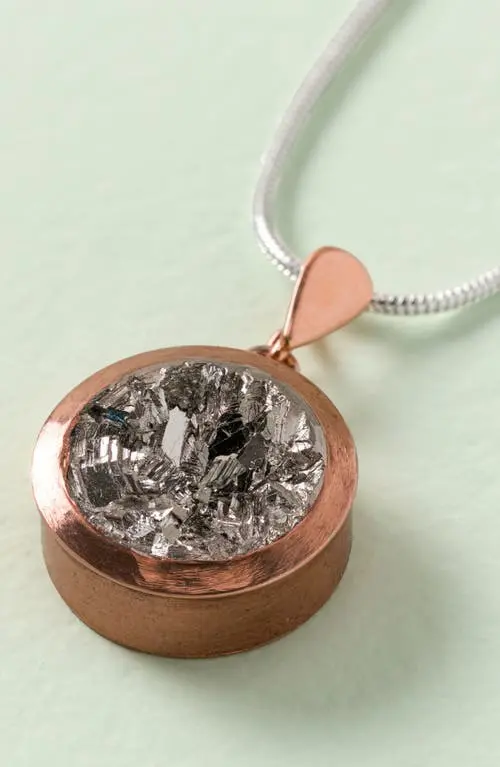 UNCOMMON GOODS Embrace Change Bismuth And Copper Pendant Necklace
