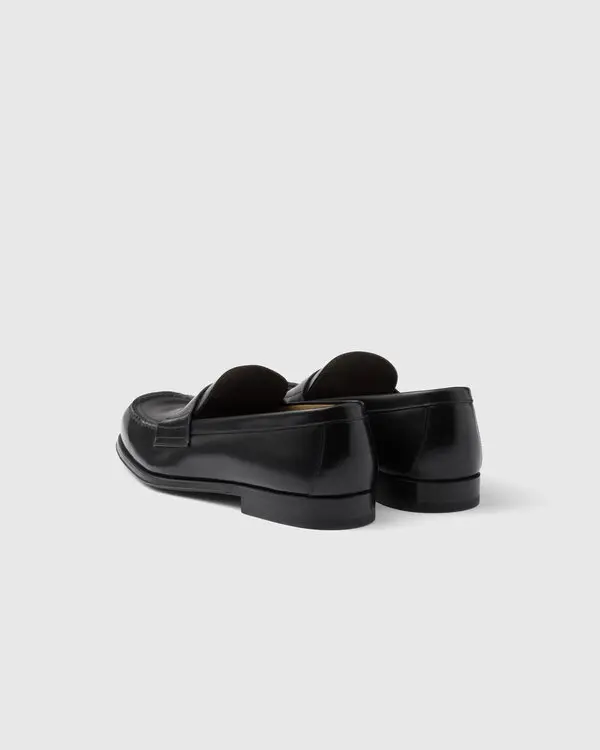 Prada Brushed Leather Loafers With Enameled Metal Triangle Logo