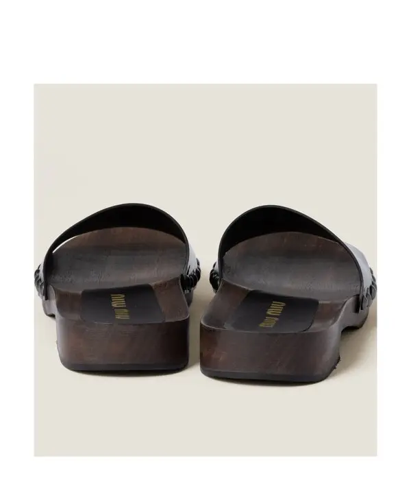 Miu Miu Patent Leather Clogs With Embossed Logo