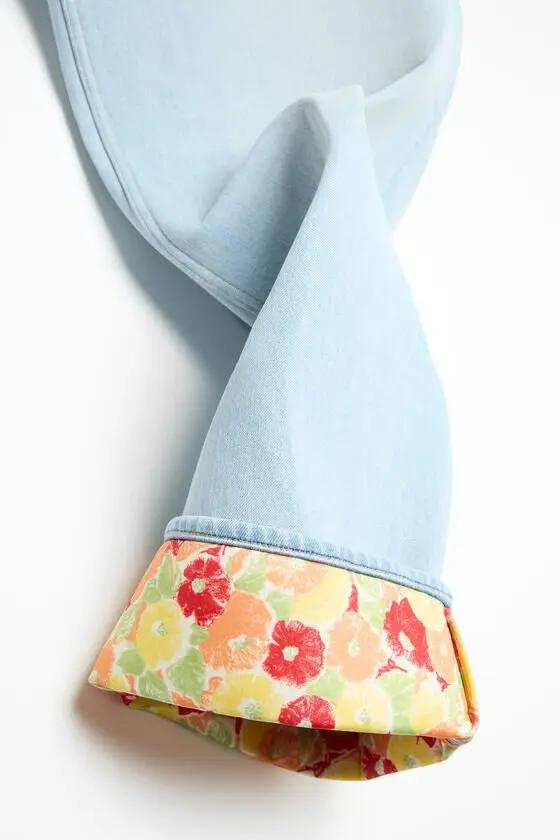 Acne Studios Light Wash Denim Trousers With Embroidered Bows