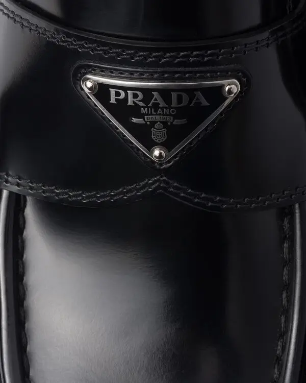 Prada Brushed Leather Loafers With Enameled Metal Logo