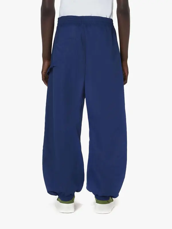 J.W.ANDERSON Jw Anderson Anchor Logo Printed Twisted Joggers