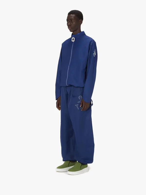 J.W.ANDERSON Jw Anderson Anchor Logo Printed Twisted Joggers
