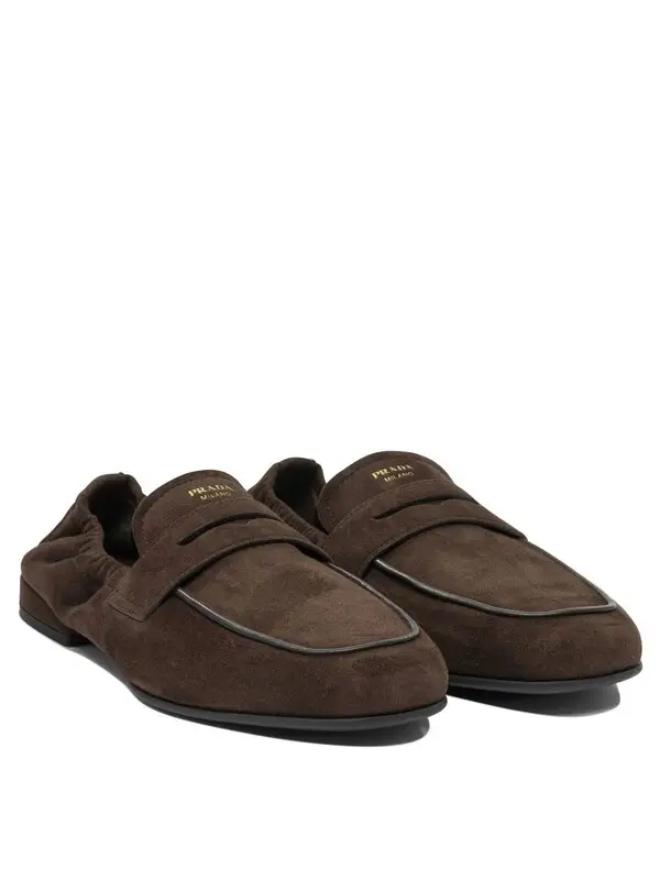 Prada Logo Printed Slip-on Loafers