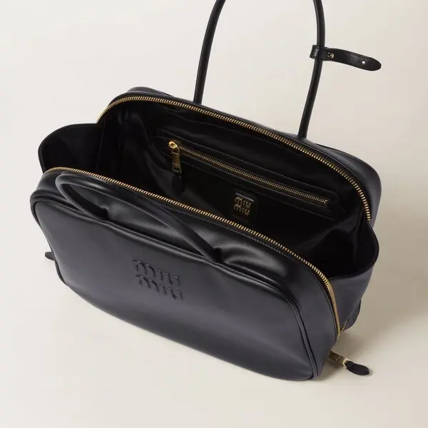 Miu Miu Logo-embossed Zipped Handbag - Black