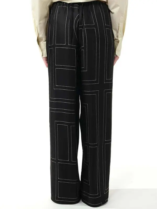TOTEME Monogram Patterned Wide-leg Silk Pajama Pants - Black