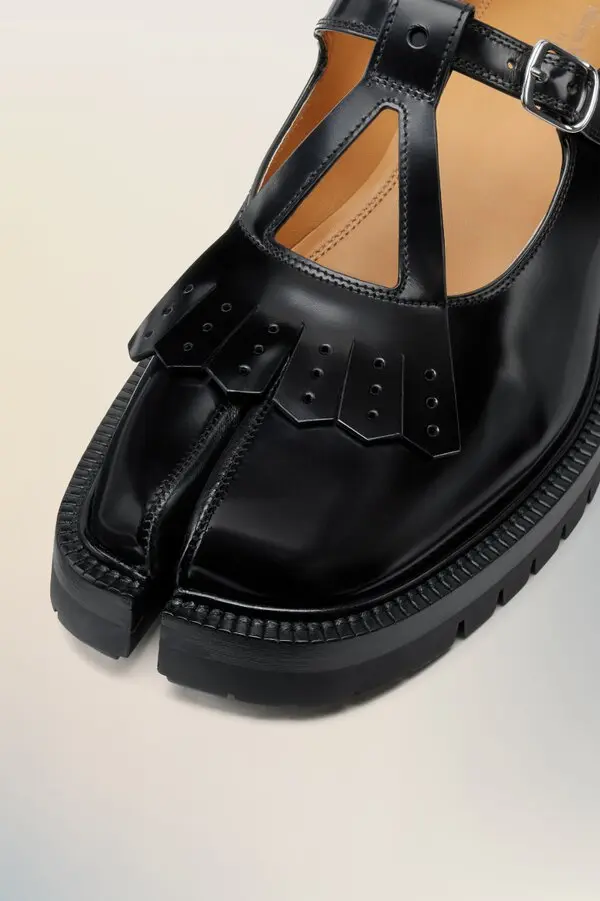 MAISON MARGIELA Tabi County Mary Jane Shoes With Buckled T-bar Strap And Fringe Detailing