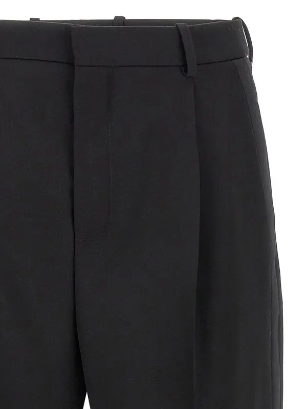 Saint Laurent Wool High-waisted Carrot Leg Pleated Pants With Ribbon Detail