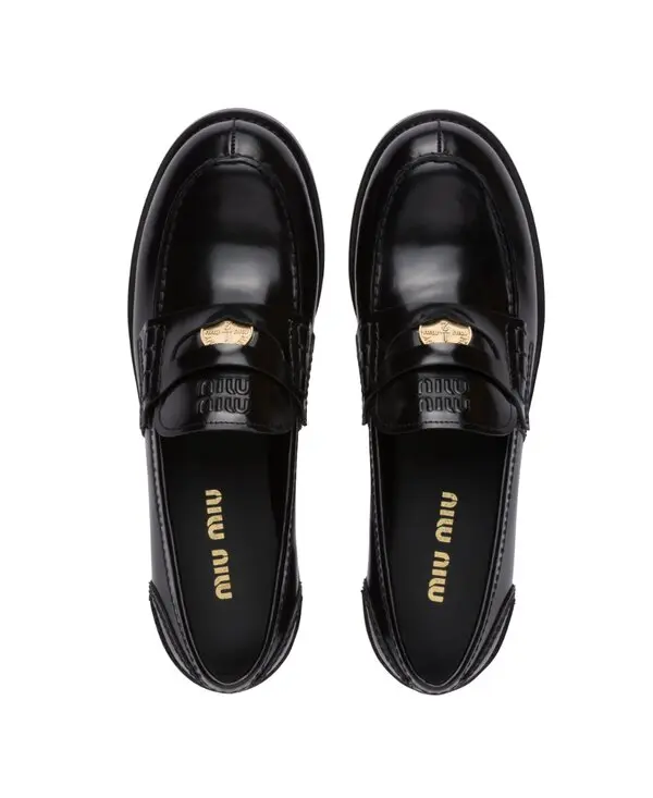 Miu Miu Round Toe Penny Loafers With Embossed Logo - Black