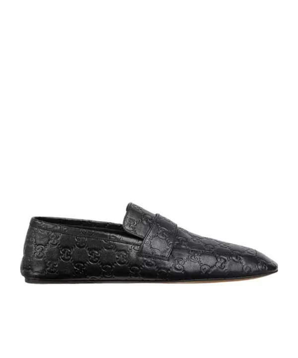 Gucci Logo Embossed Leather Loafers