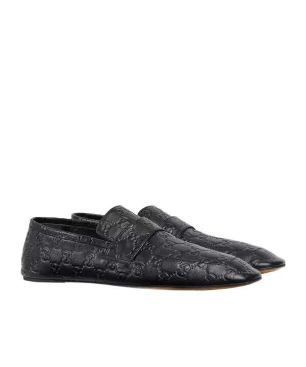 Gucci Logo Embossed Leather Loafers