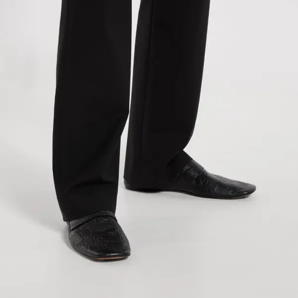 Gucci Logo Embossed Leather Loafers