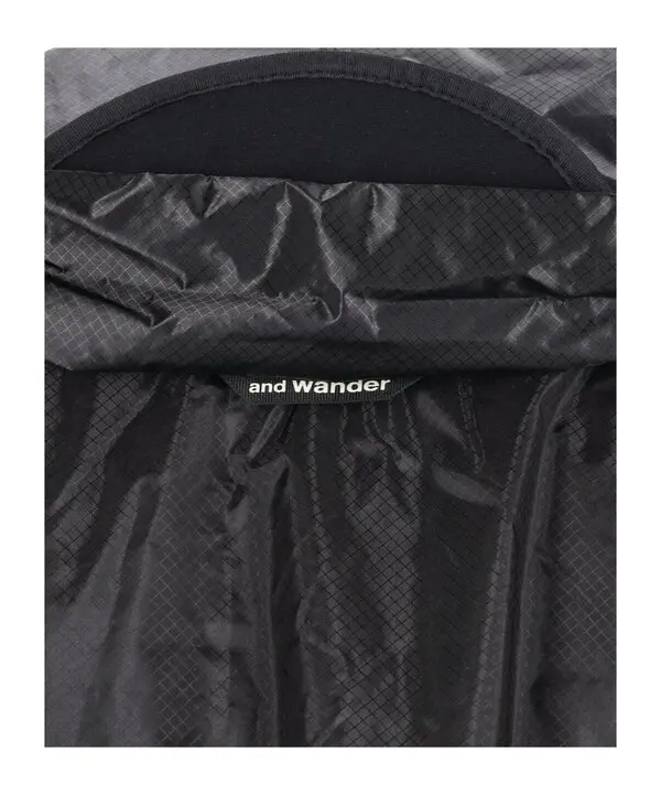 AND WANDER Drawstring Hooded Raincoat