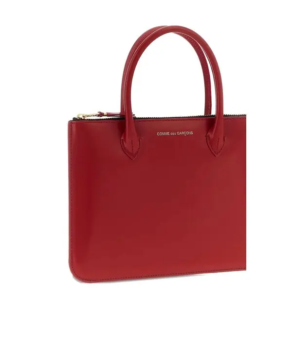 Comme Des Garçons Logo Printed Handbag