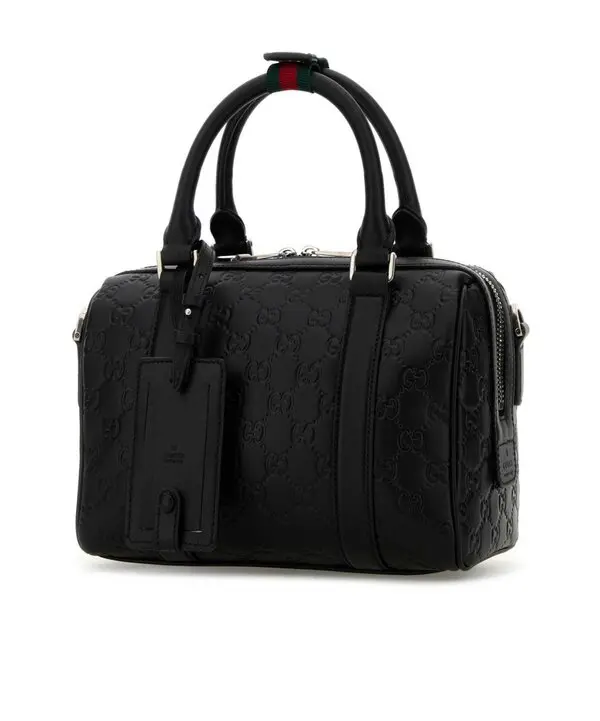 Gucci Monogram Embossed Leather Duffle Bag
