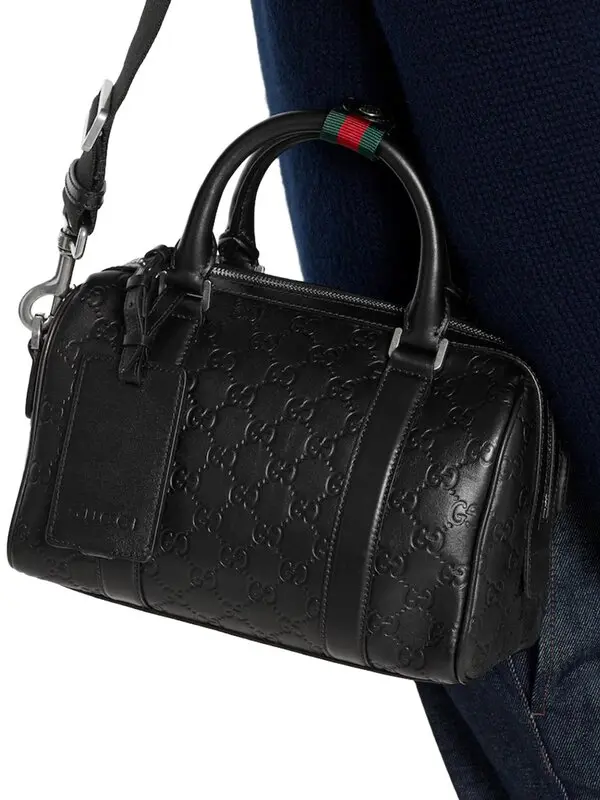 Gucci Monogram Embossed Leather Duffle Bag