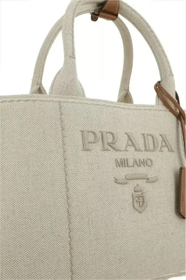 Prada Logo Embroidered Top Handle Bag - Beige