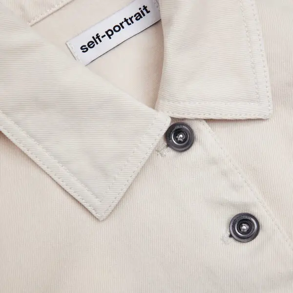 SELF-PORTRAIT Logo-embossed Cropped Jacket - Cream