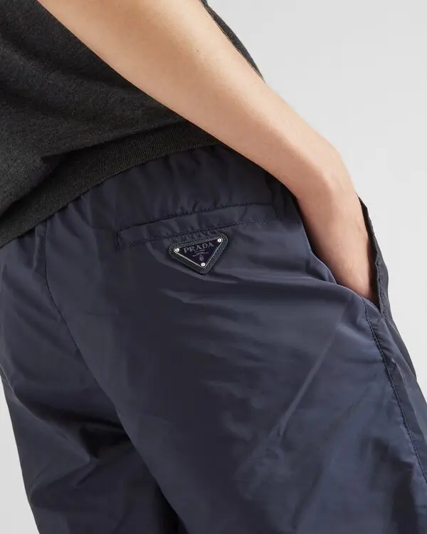 Prada Triangle Logo Plaque Elastic Swim Shorts - Blue