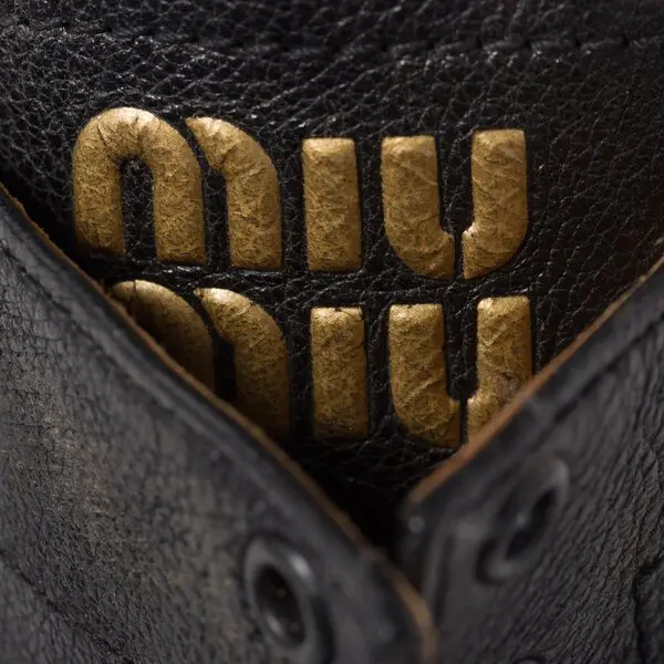 Miu Miu Embossed Logo Lace-up Boots - Black