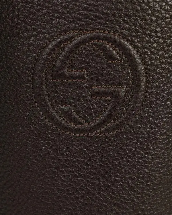 Gucci Embossed Logo Leather Boots